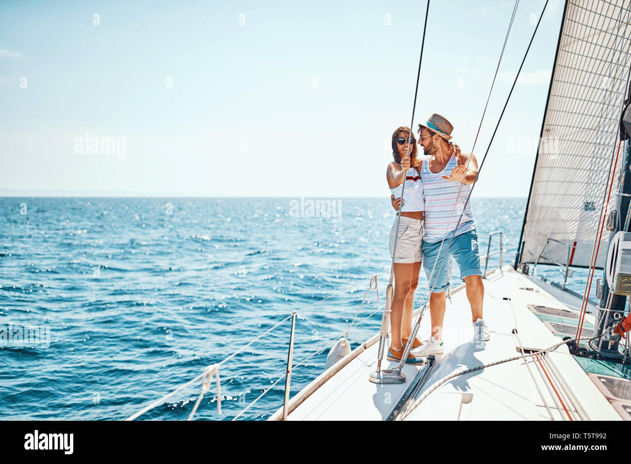Romance on a sailboat – Young man and woman in love Stock Photo - Alamy