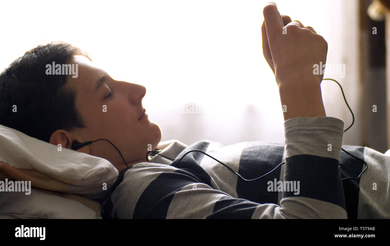 Teen boy talking on smart phone hi-res stock photography and images - Alamy
