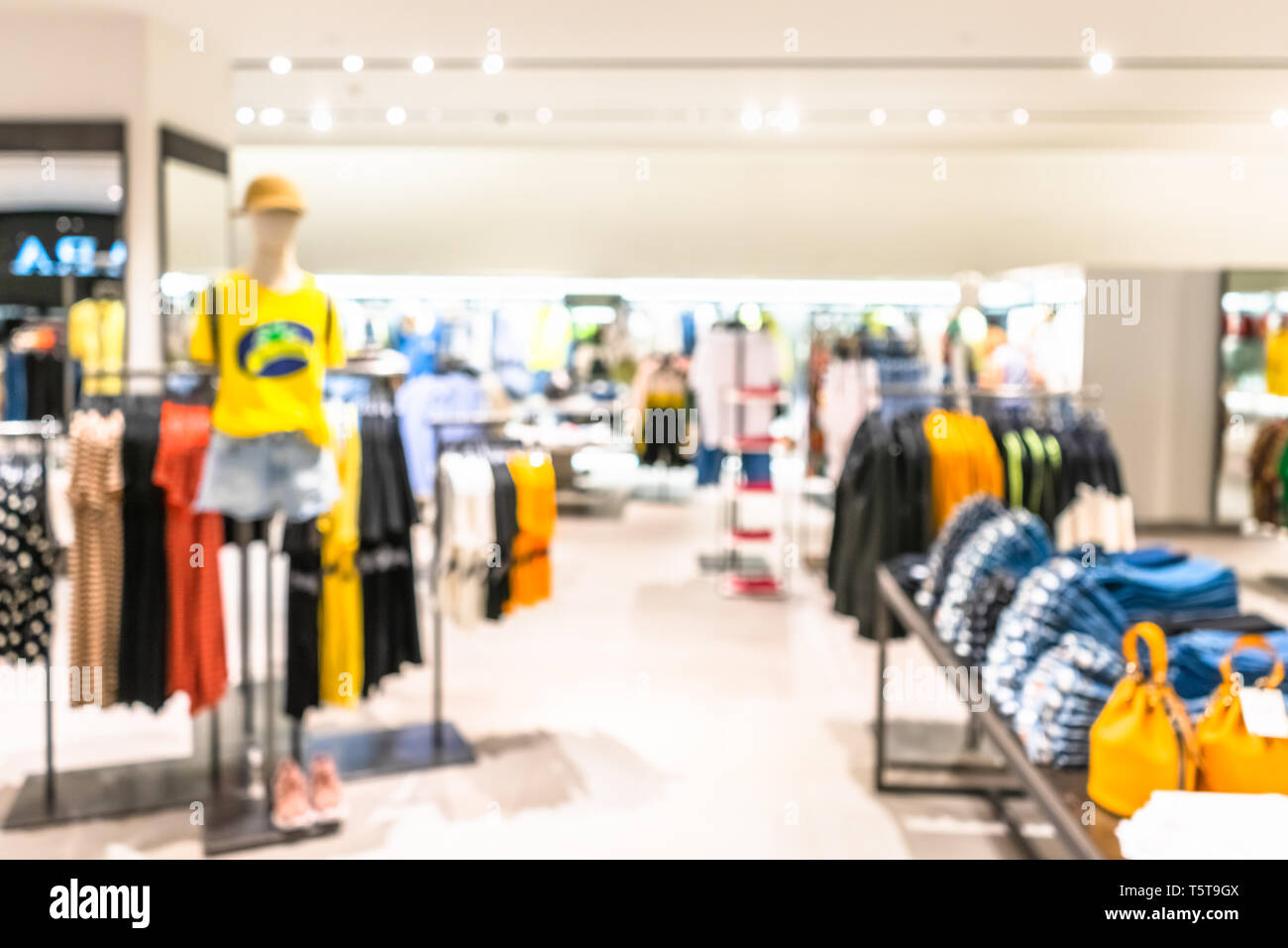 Abstract blurred of fashion boutique clothing store with bokeh use for ...