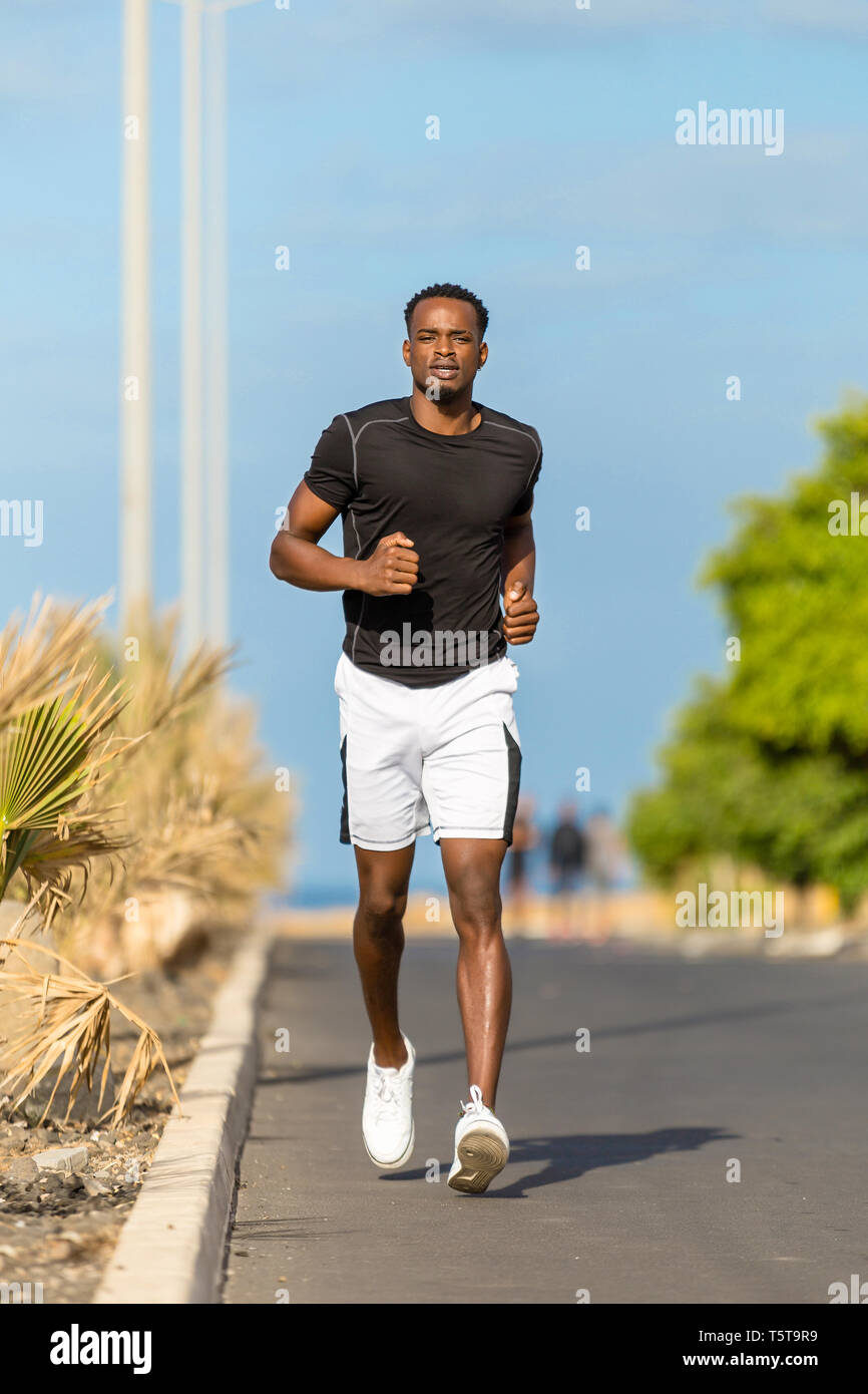 Young man running outdoor hi-res stock photography and images - Alamy
