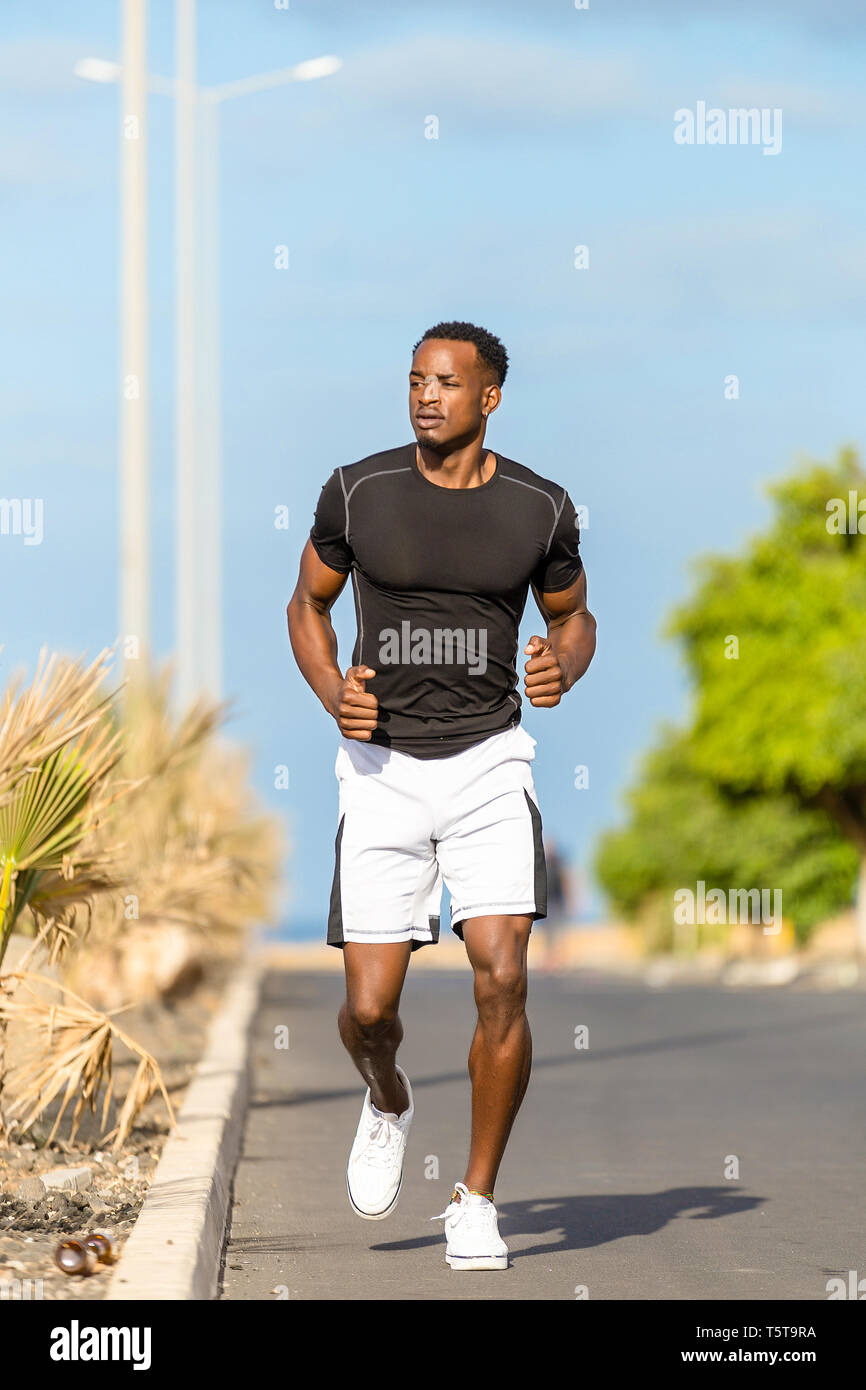Young man running outdoor hi-res stock photography and images - Alamy