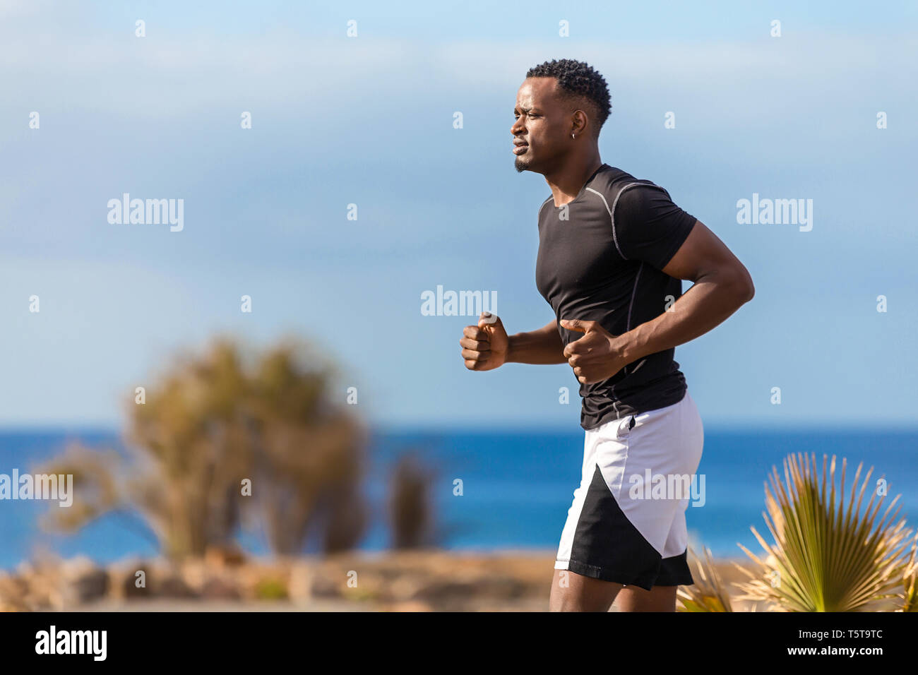 Young man running outdoor hi-res stock photography and images - Alamy