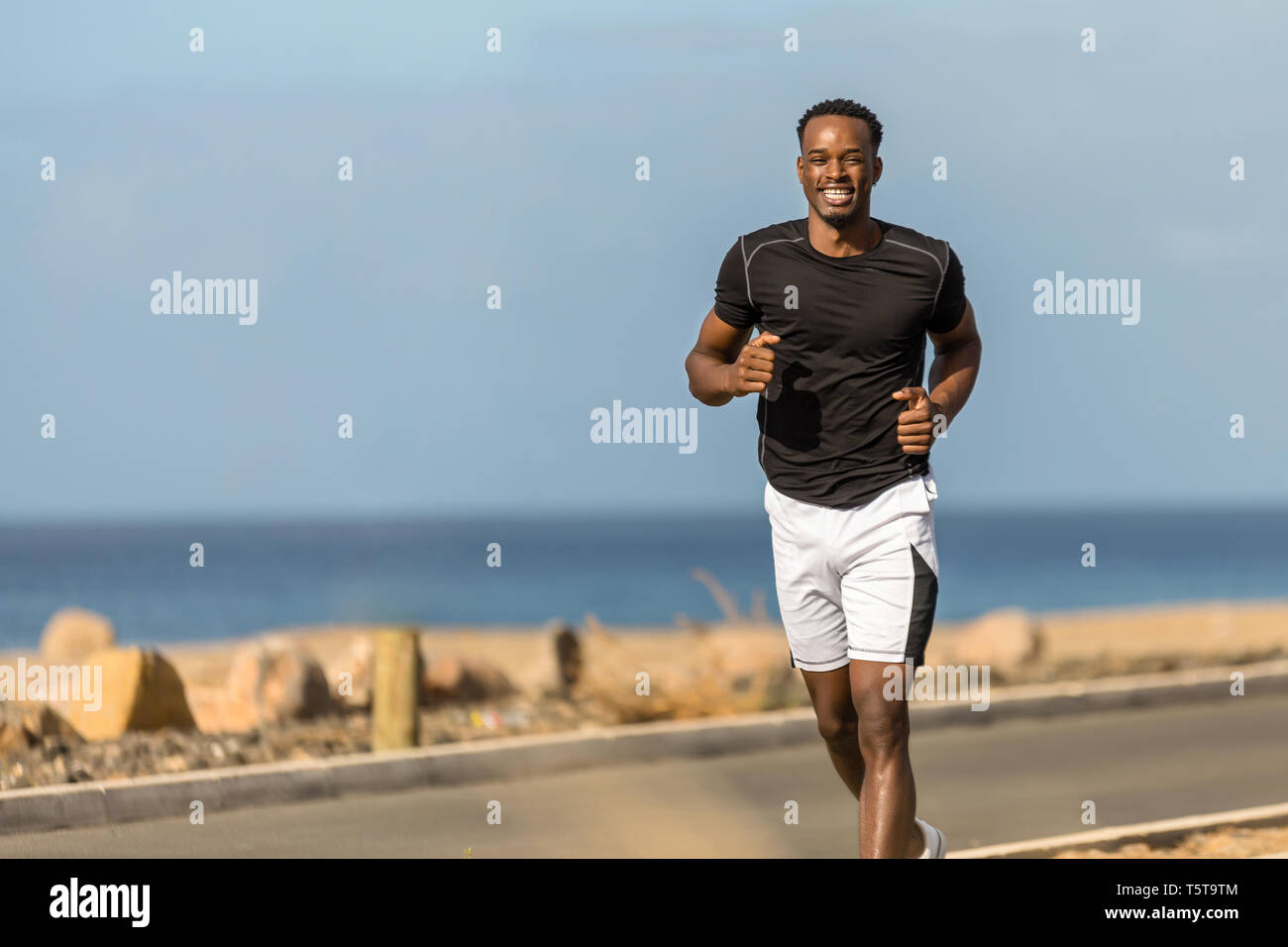 Young man running outdoor hi-res stock photography and images - Alamy
