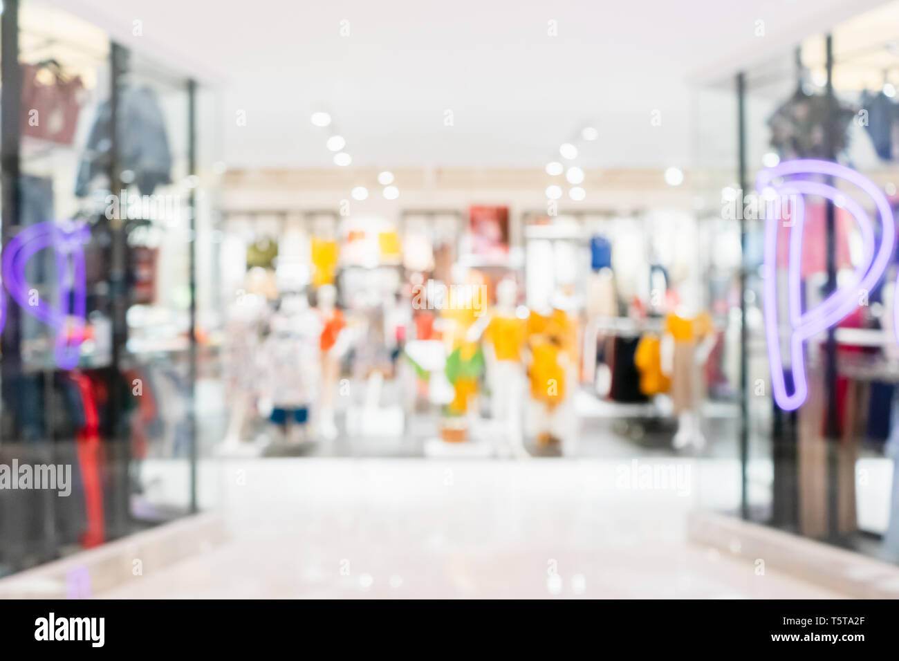 Abstract blurred of fashion boutique clothing store with bokeh use for ...