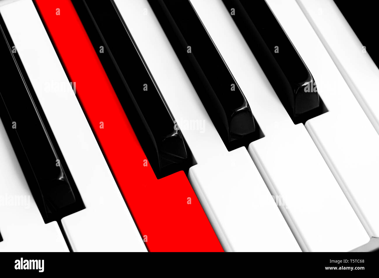 Top view of piano keys with one red button. Close-up of piano keys ...