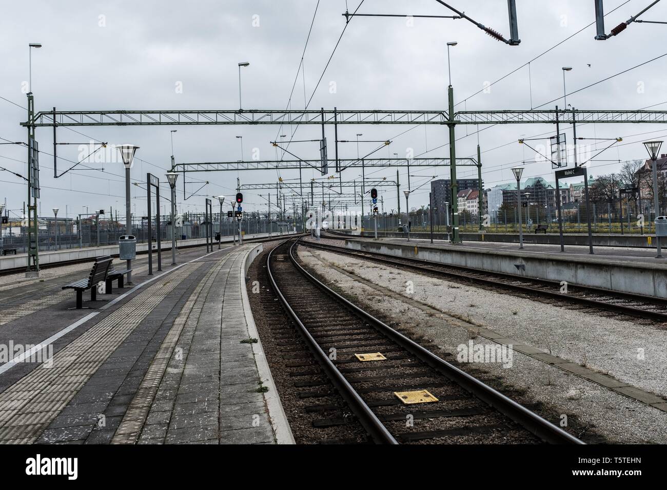 Train railways with wires and metal bridges Stock Photo - Alamy
