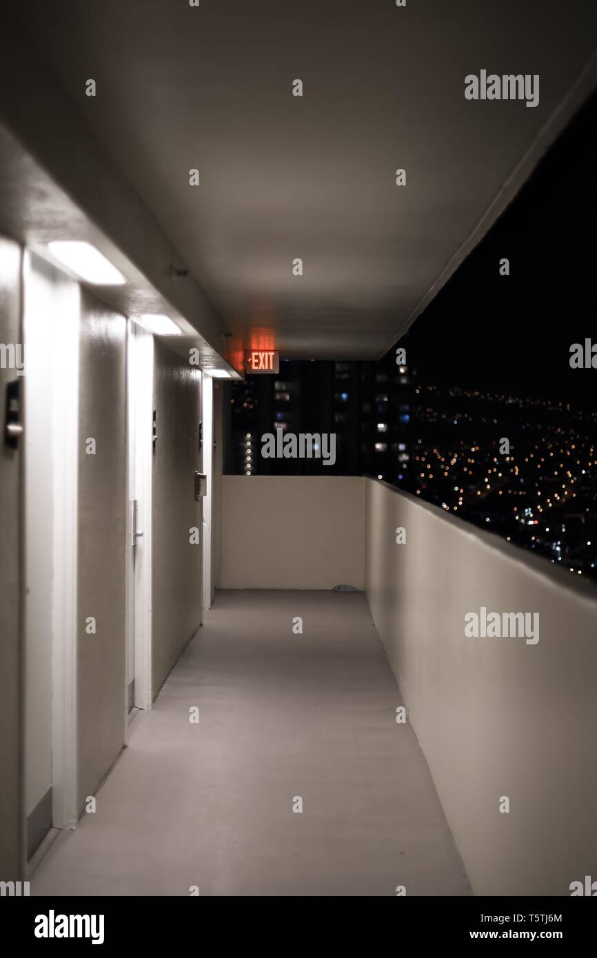 City lights at night shot form a balcony with EXIT sign Stock Photo - Alamy