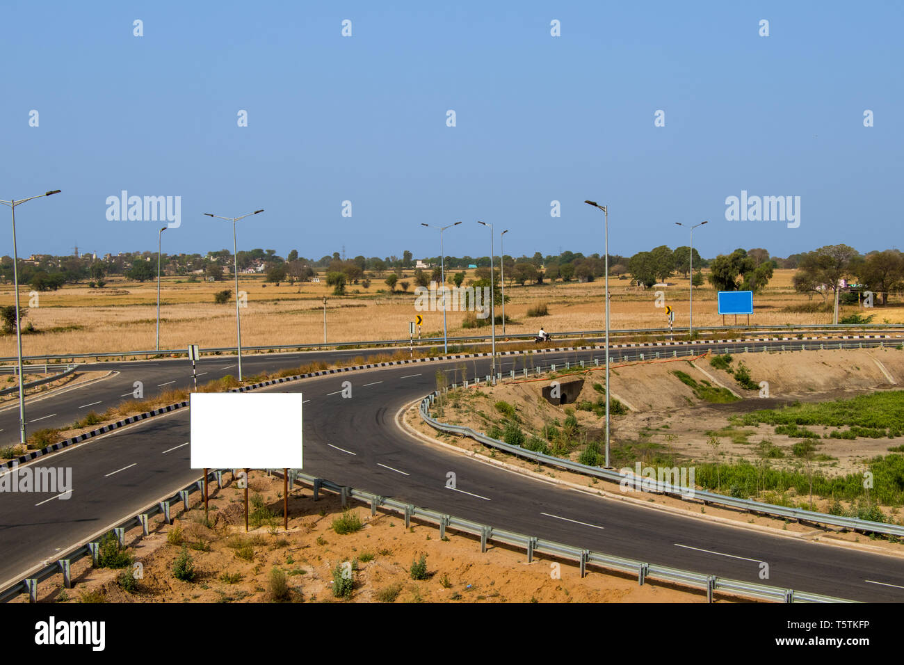 Highway curve road in bright sunny day Stock Photo - Alamy