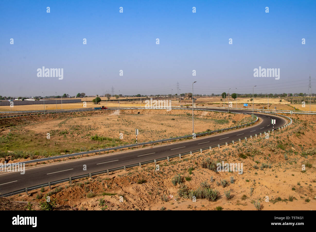 Highway curve road in bright sunny day Stock Photo - Alamy