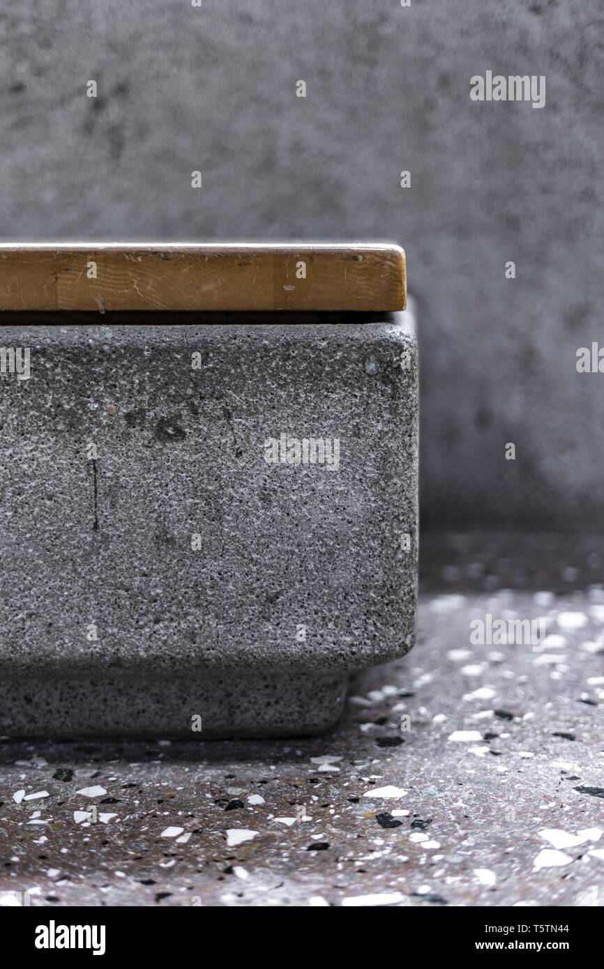 A closeup of a side of a stone bench Stock Photo - Alamy