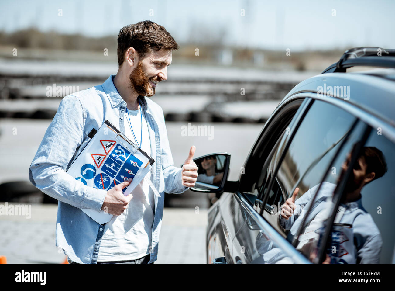 Instructor explaining the route scheme of training for a driver who ...