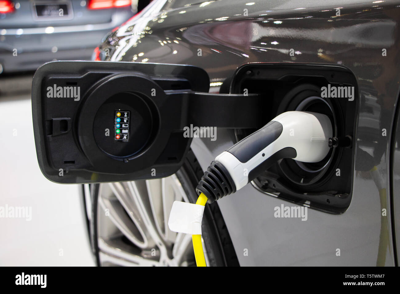 Electric car charging plug Stock Photo - Alamy