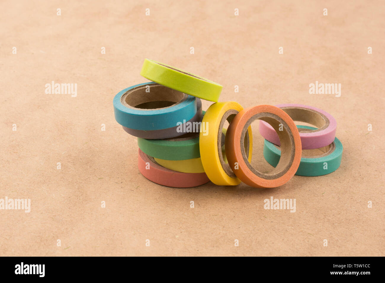 Color ribbon tapes on a wooden background Stock Photo - Alamy