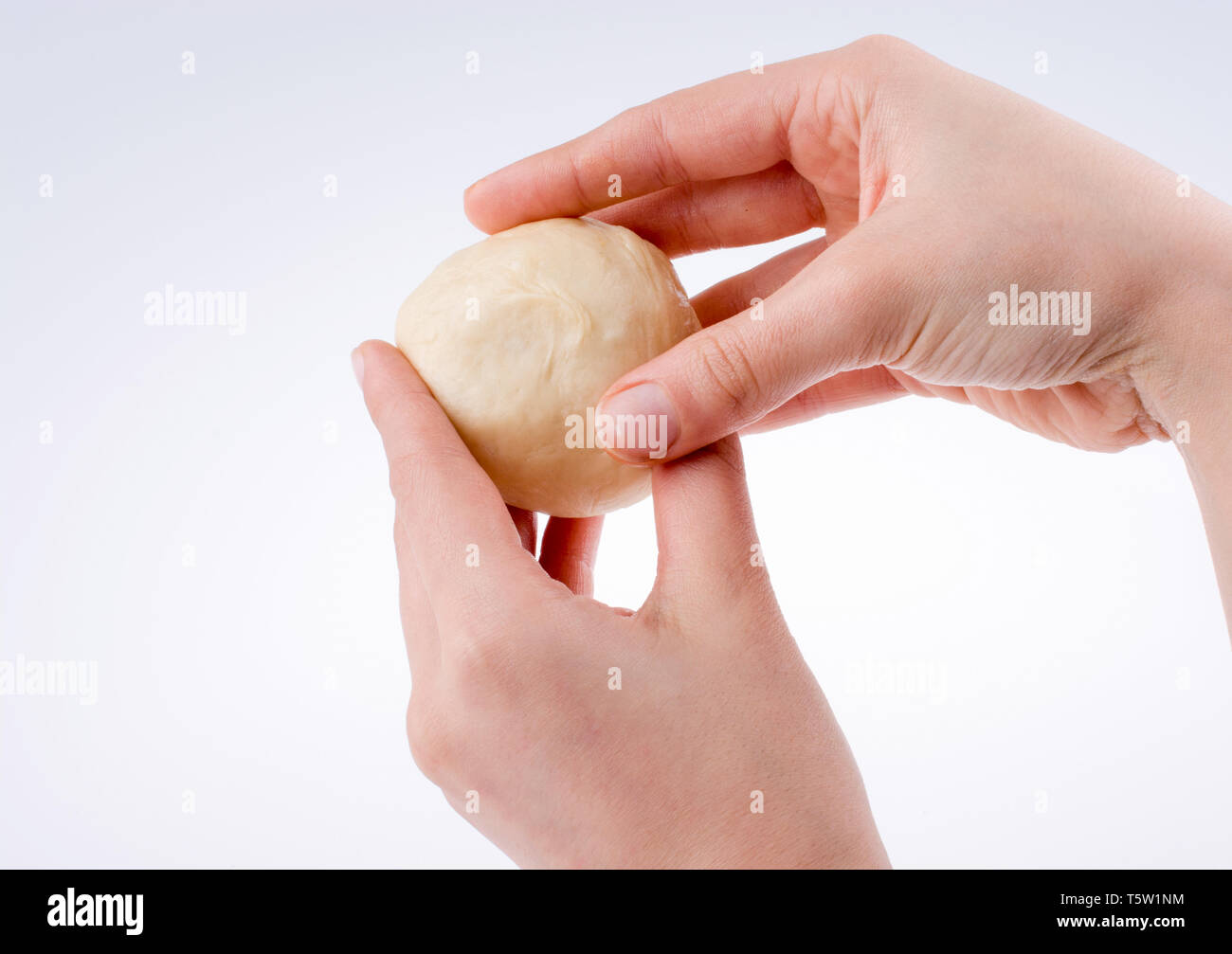 Hand holding paste on a white background Stock Photo - Alamy