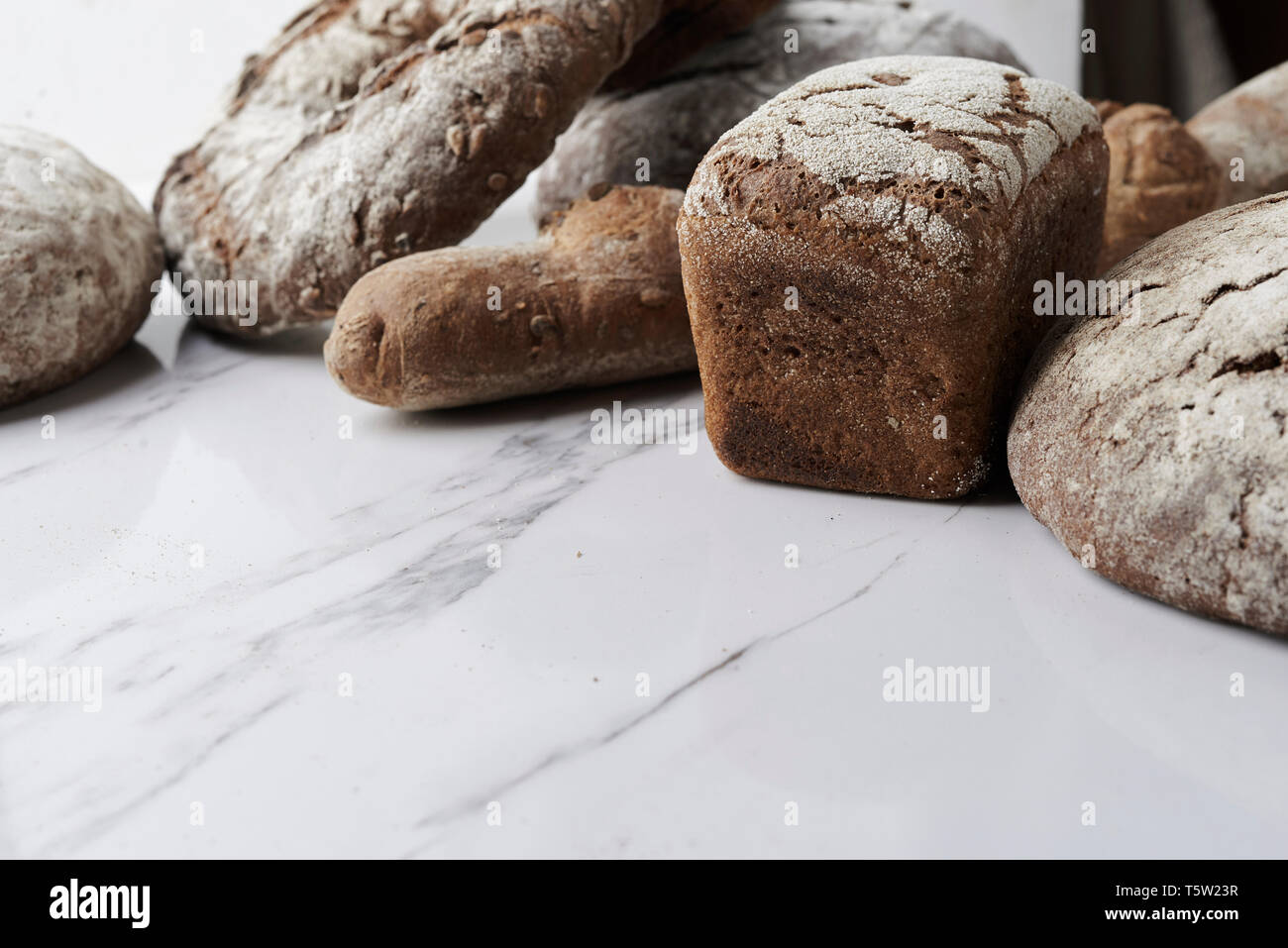 rustic bread loaves marble background Stock Photo - Alamy