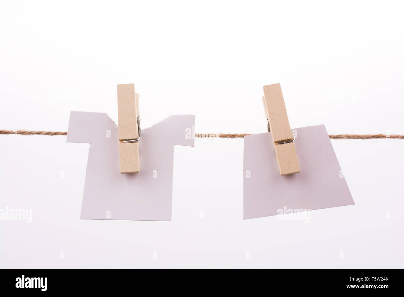 Clothespins holding clothes Stock Photo - Alamy