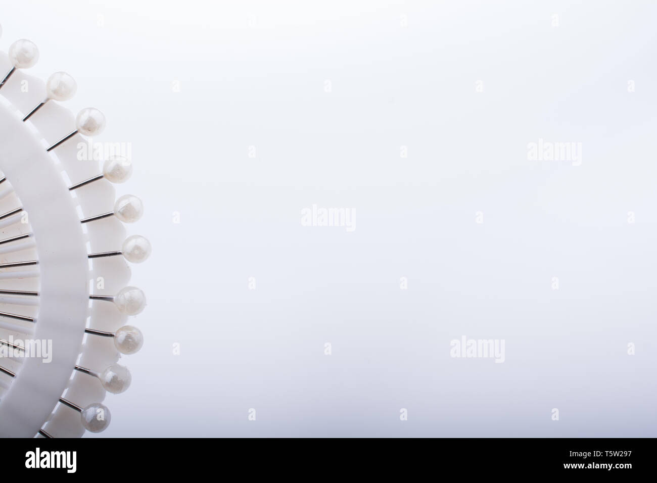 White round needle set on a white background Stock Photo - Alamy