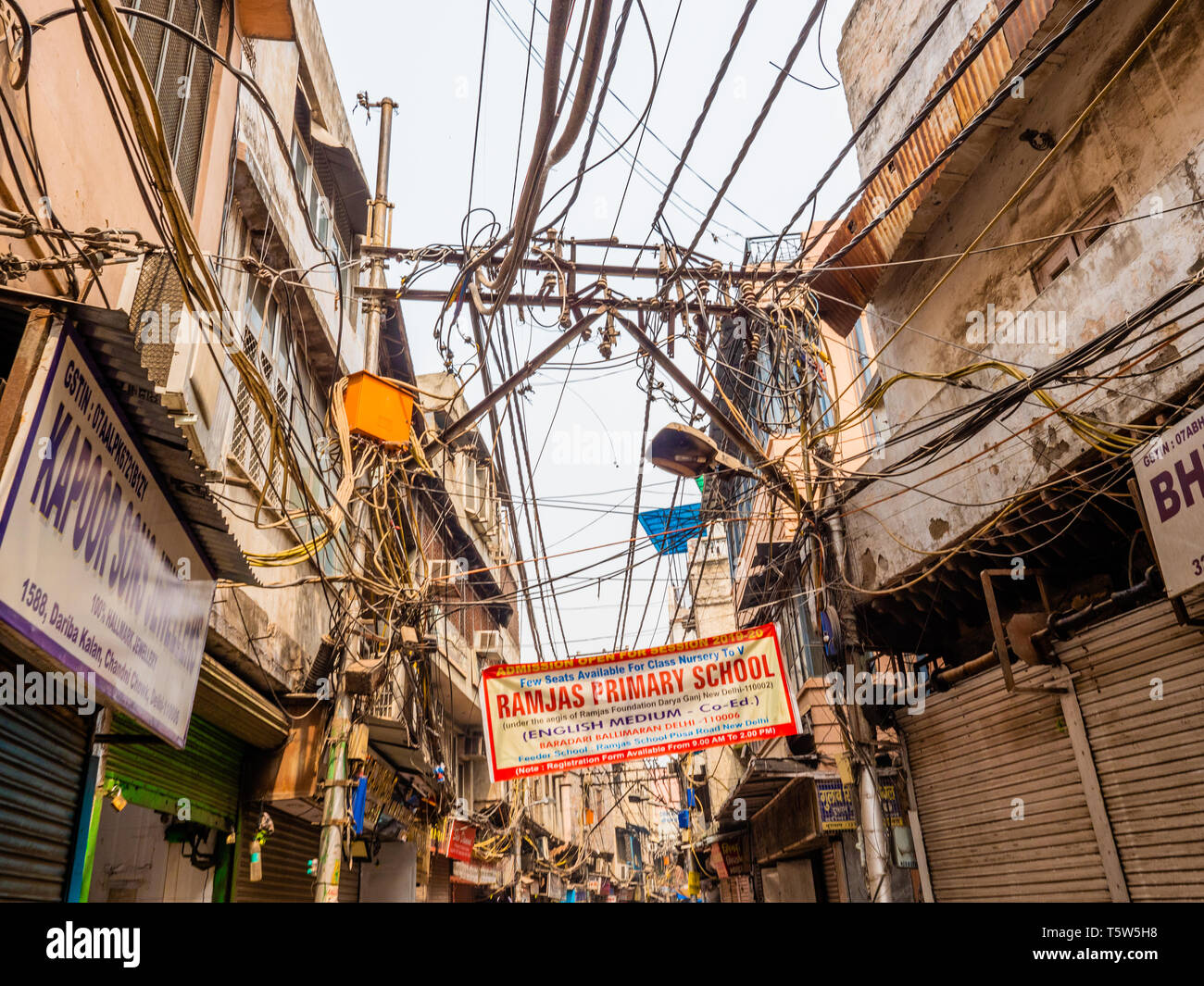 Busy streets with chaotic electricity and telephone wires in the old ...
