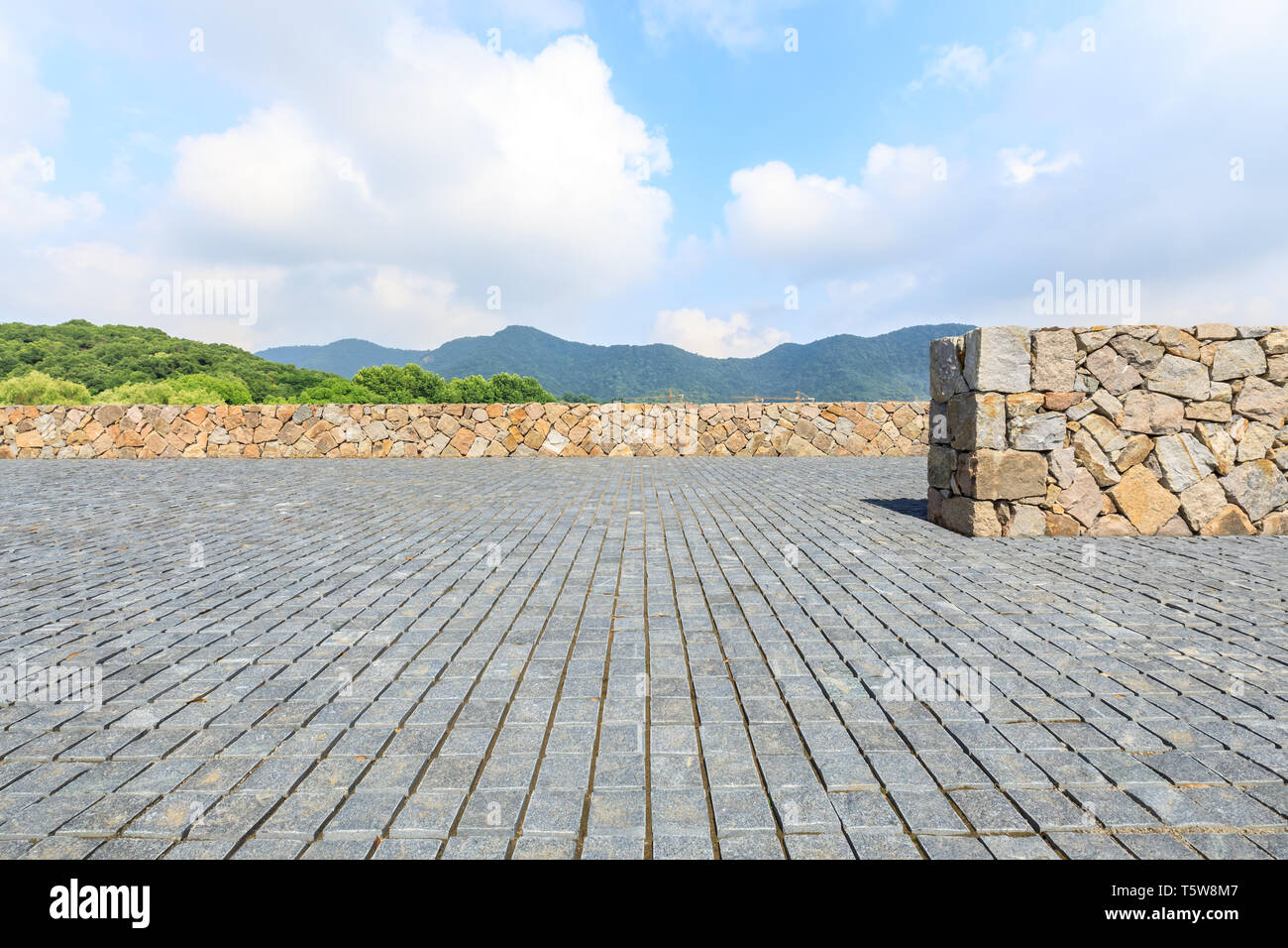 Rough square stone floor and green mountain with sky landscape Stock ...