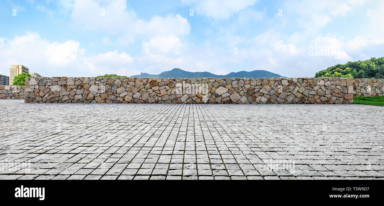 Rough square stone floor and green mountain with sky landscape Stock ...