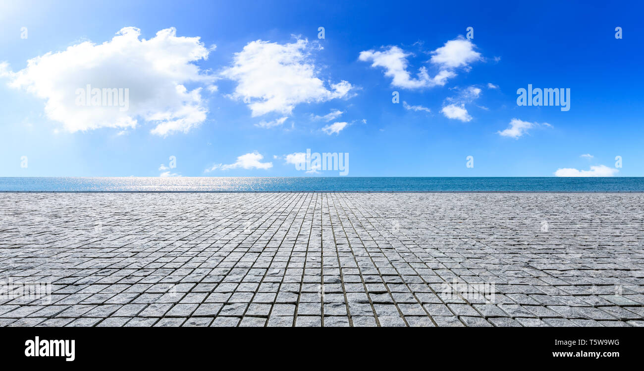 Rough square stone floor and blue sea with sky background Stock Photo ...