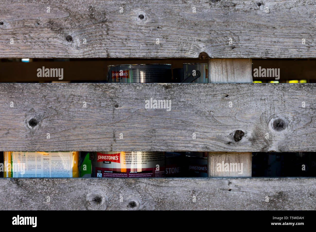 timber storage area on construction site storing tins of Johnstones ...