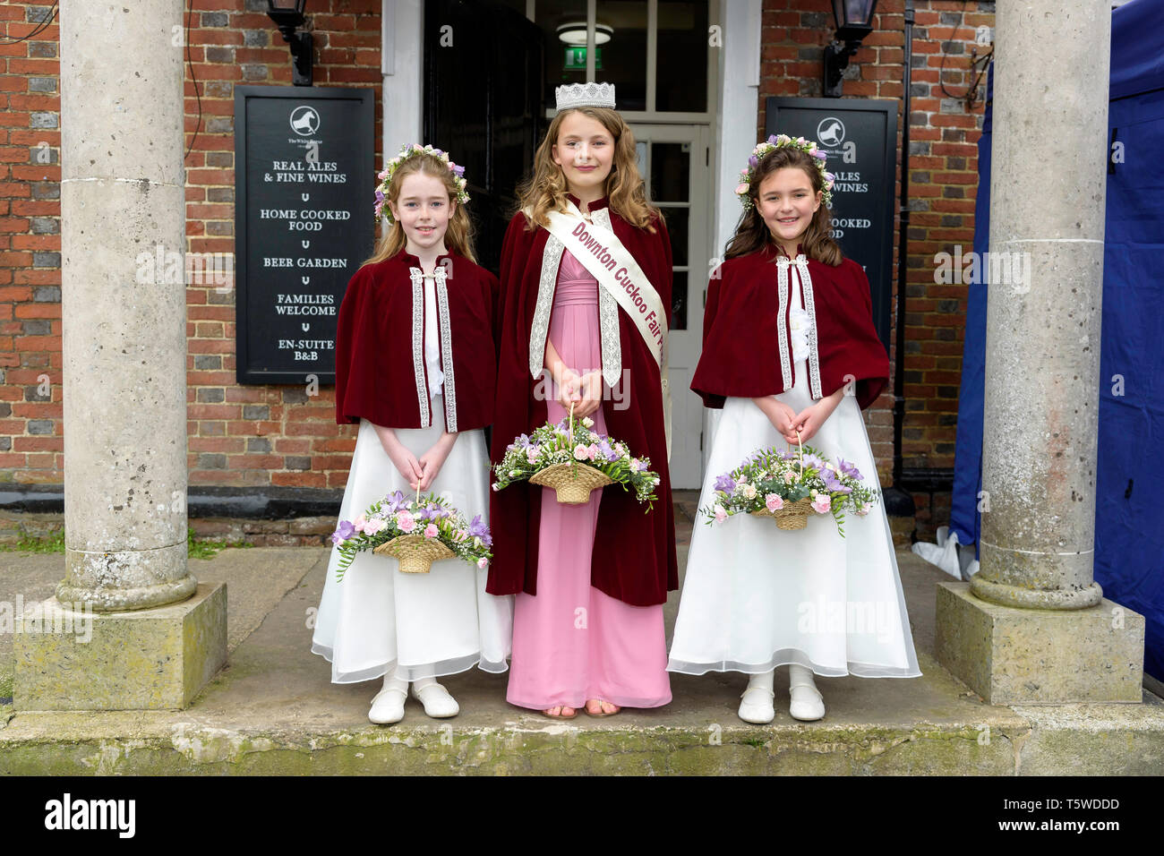 Princess and attendants holding flower baskets at the annual Downton ...