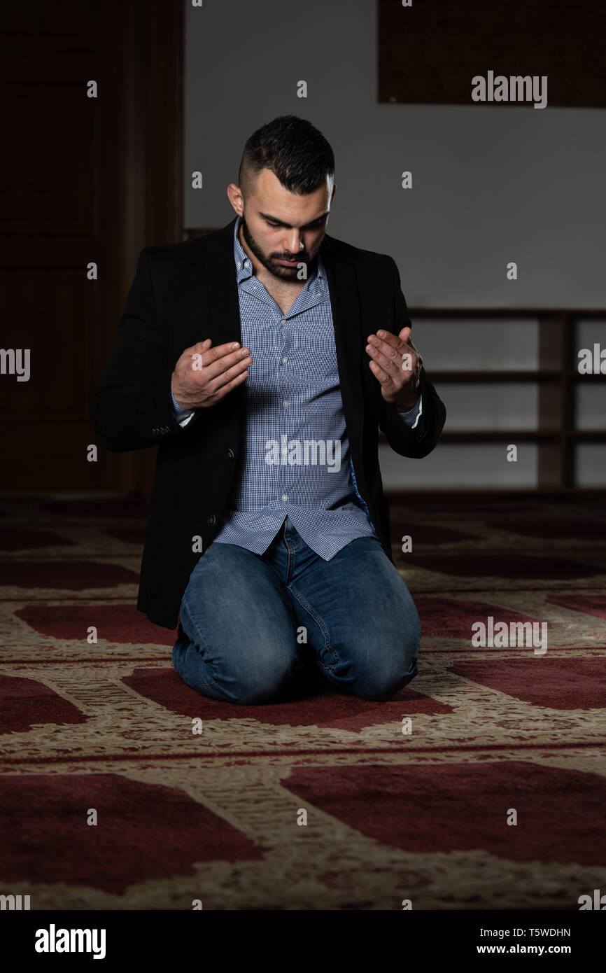 Attractive Man Making Traditional Prayer to God Allah in the Mosque ...
