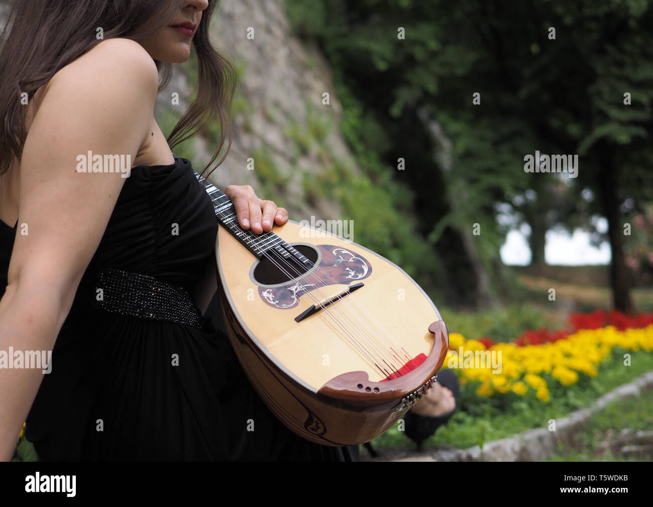Musician posing with beautiful italian mandolin Stock Photo - Alamy