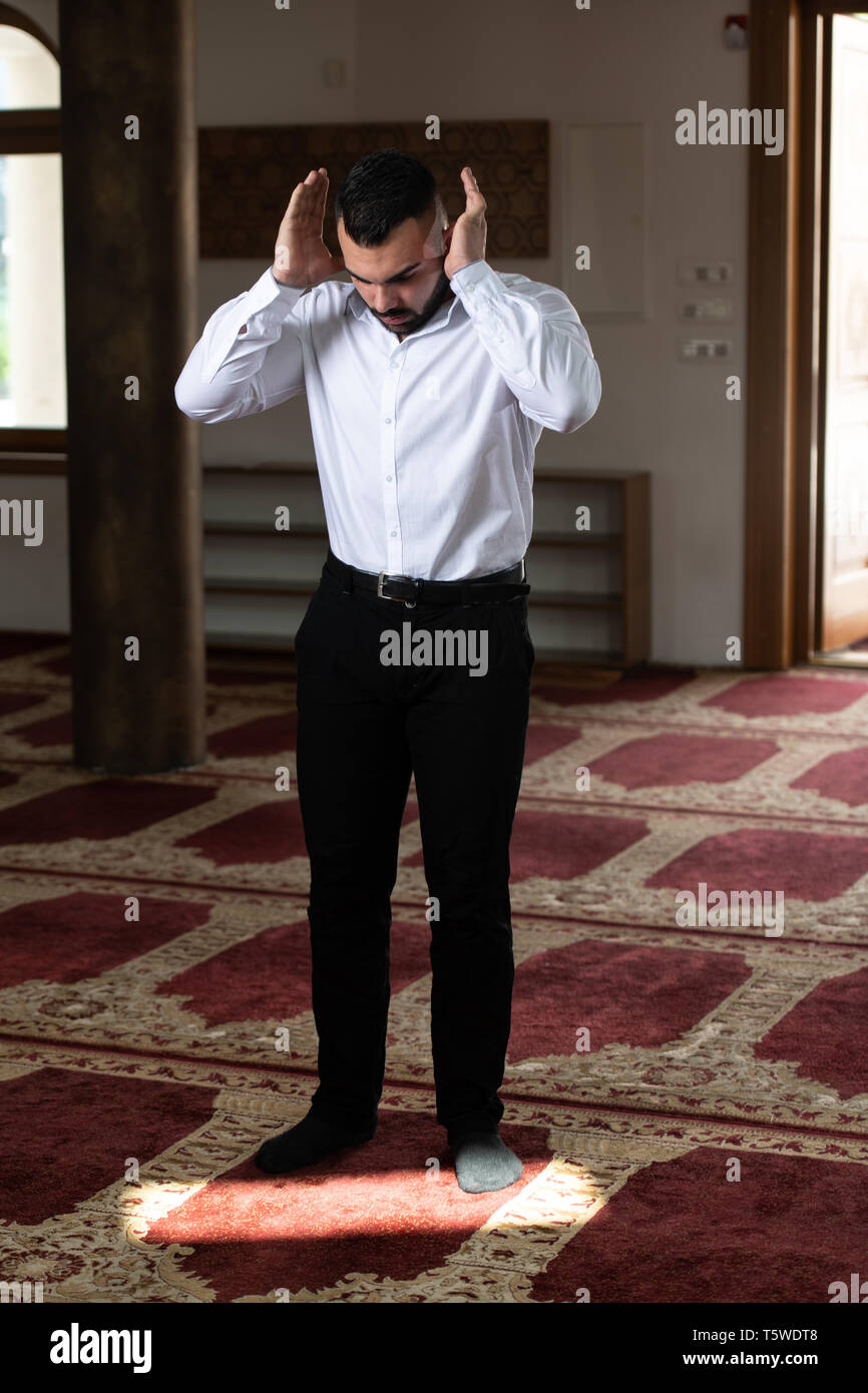 Attractive Man Making Traditional Prayer to God Allah in the Mosque ...