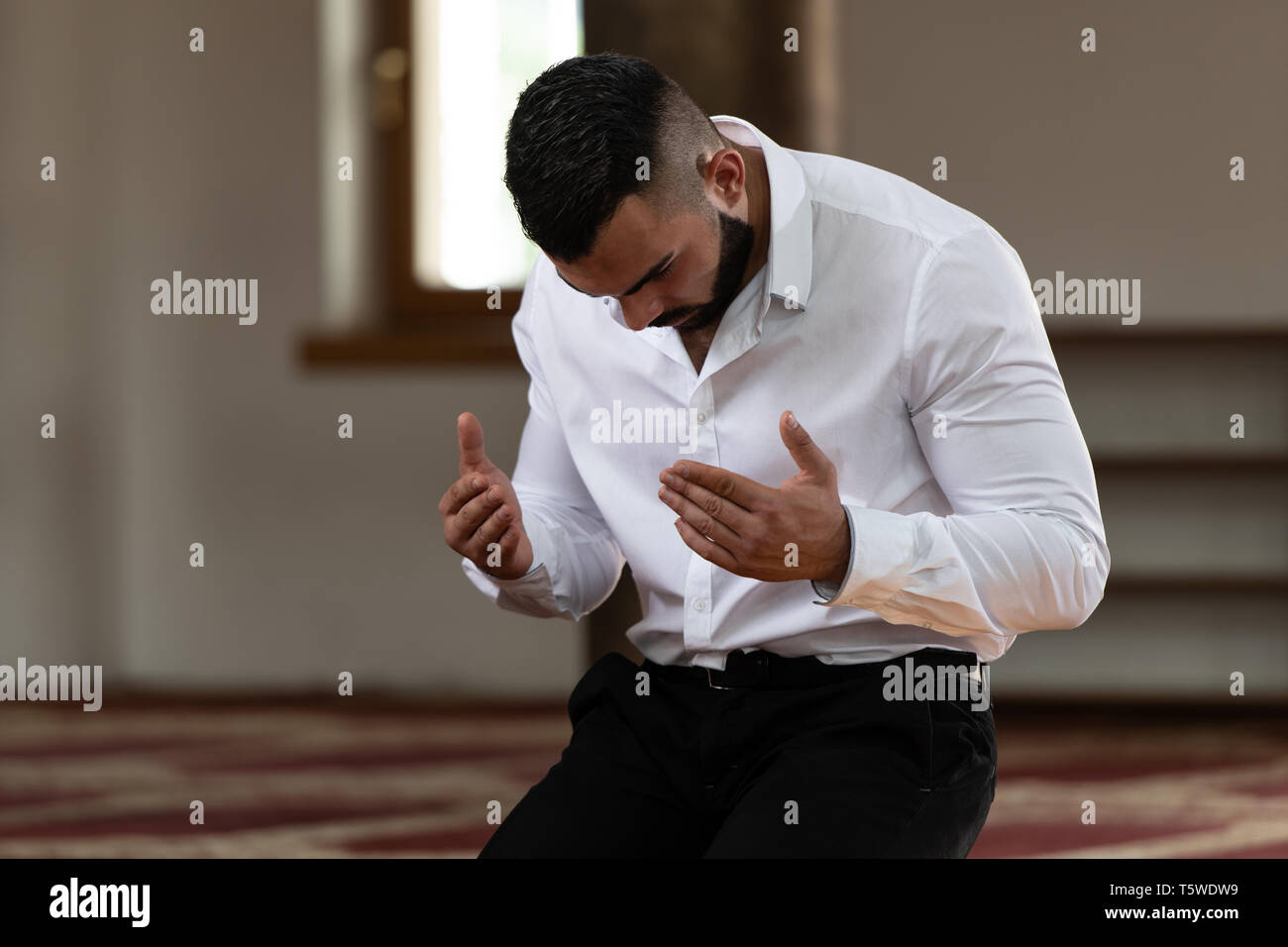 Attractive Man Making Traditional Prayer to God Allah in the Mosque ...