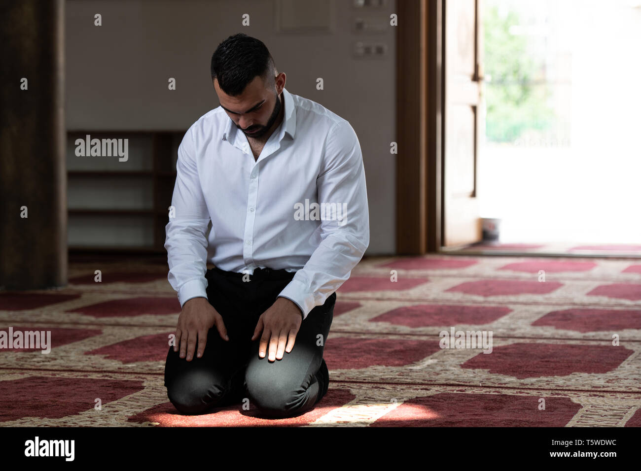Attractive Man Making Traditional Prayer to God Allah in the Mosque ...
