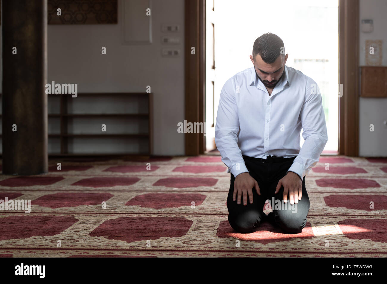 Attractive Man Making Traditional Prayer to God Allah in the Mosque ...