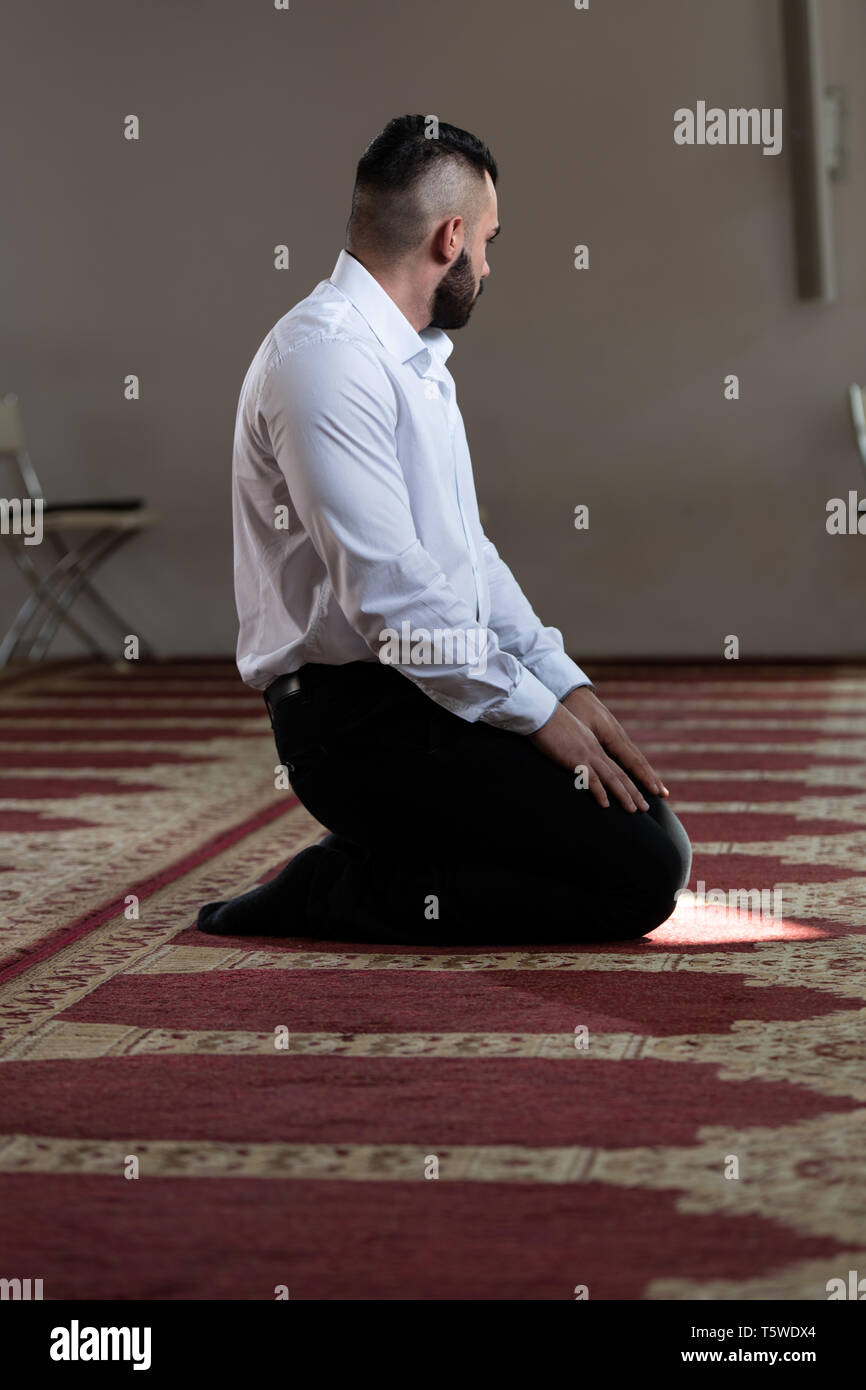 Attractive Man Making Traditional Prayer to God Allah in the Mosque ...