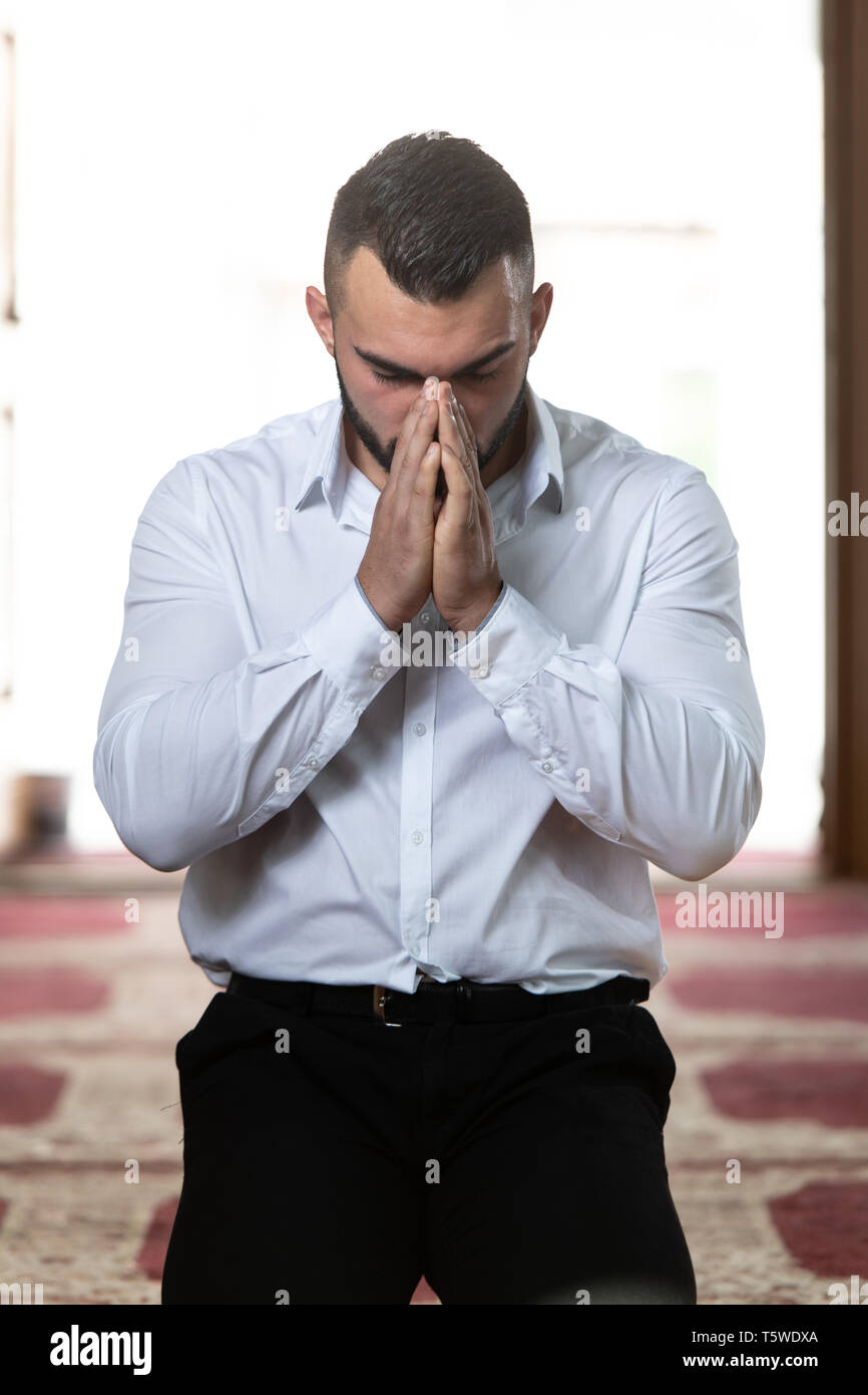 Attractive Man Making Traditional Prayer to God Allah in the Mosque ...