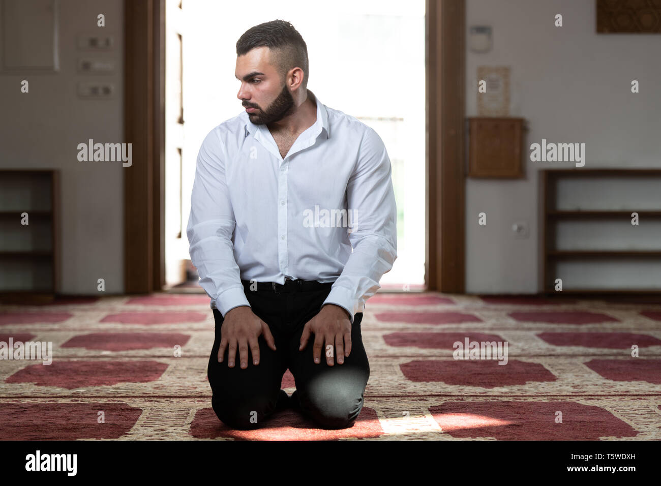 Attractive Man Making Traditional Prayer to God Allah in the Mosque ...