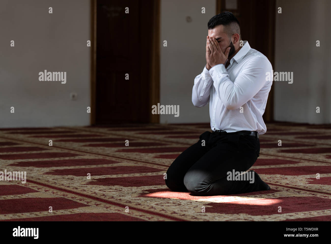 Attractive Man Making Traditional Prayer to God Allah in the Mosque ...