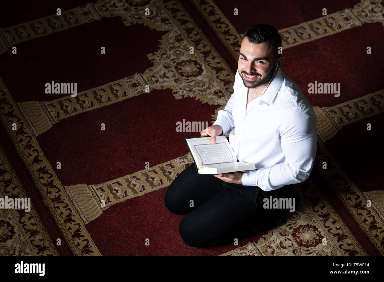 Businessman Muslim Is Listen On Headset The Koran Making Traditional ...