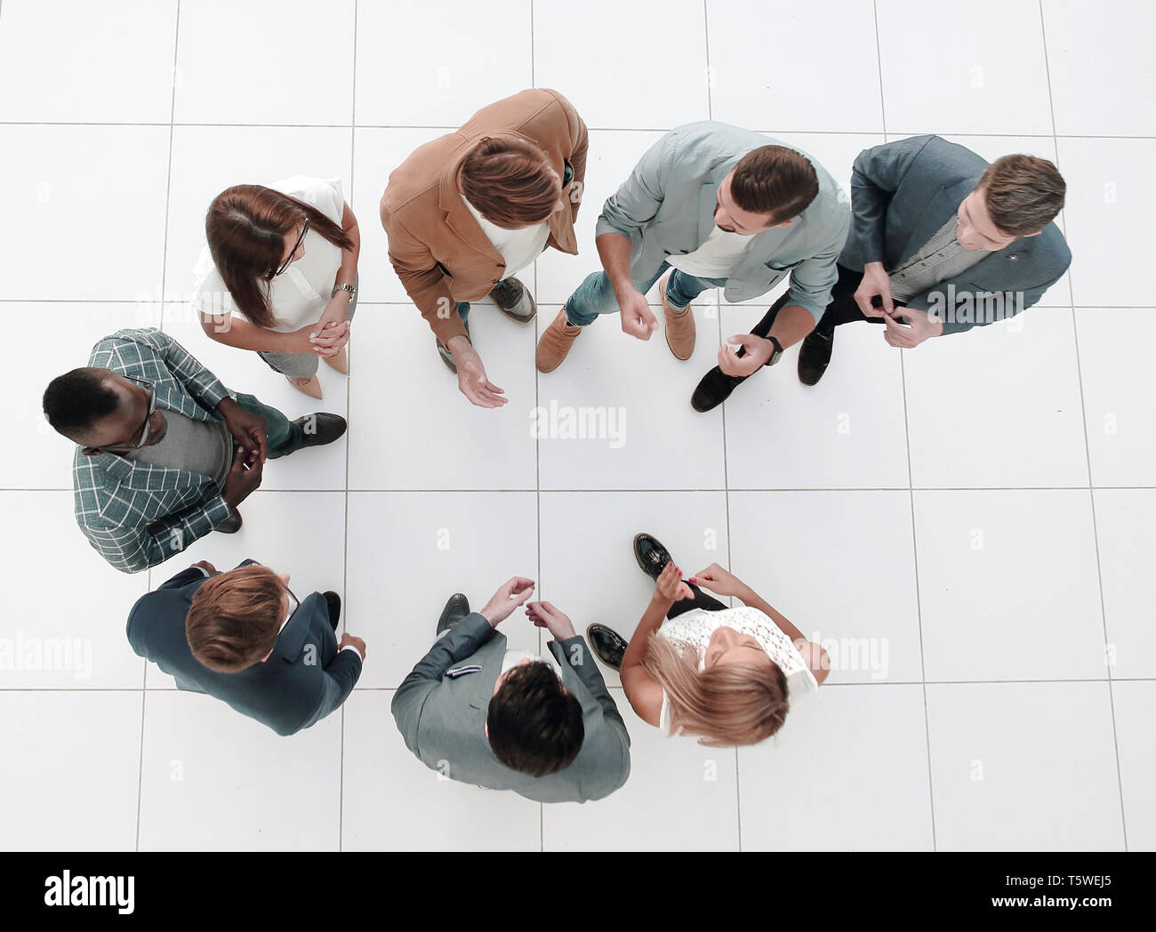 top view.a group of employees standing in the lobby of the office.photo ...