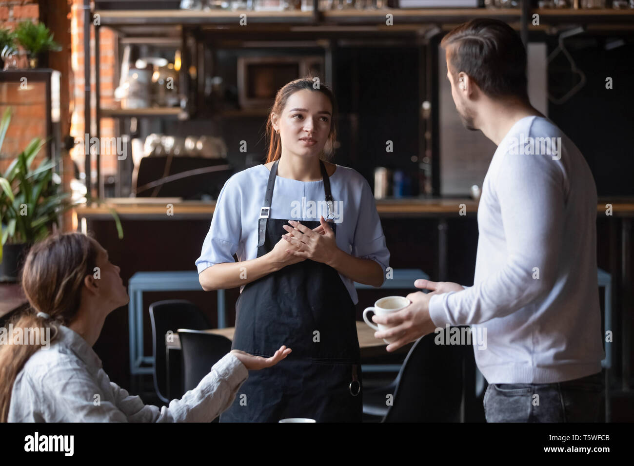 Dissatisfied restaurant clients complaining about bad service Stock ...