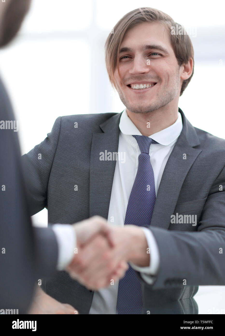 vertical photo.handshake business people .close up Stock Photo - Alamy