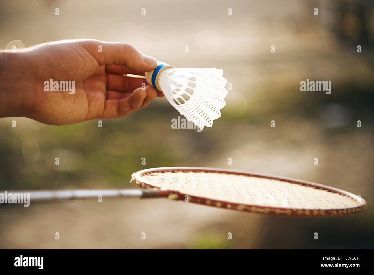 A human holds a red racket in his hands and is going to throw a ...