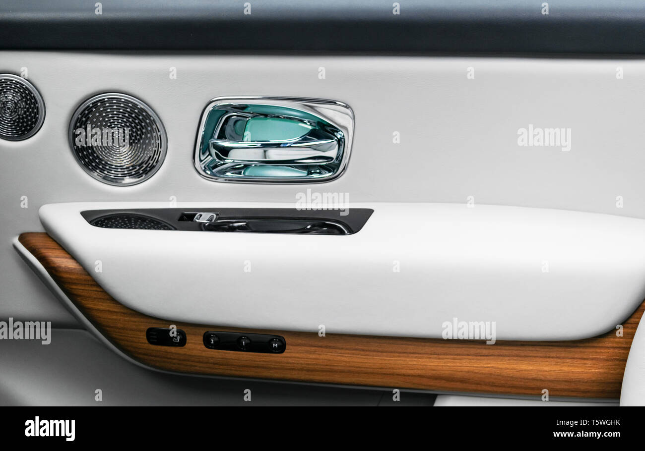 Door handle with power window control buttons of a luxury passenger car ...