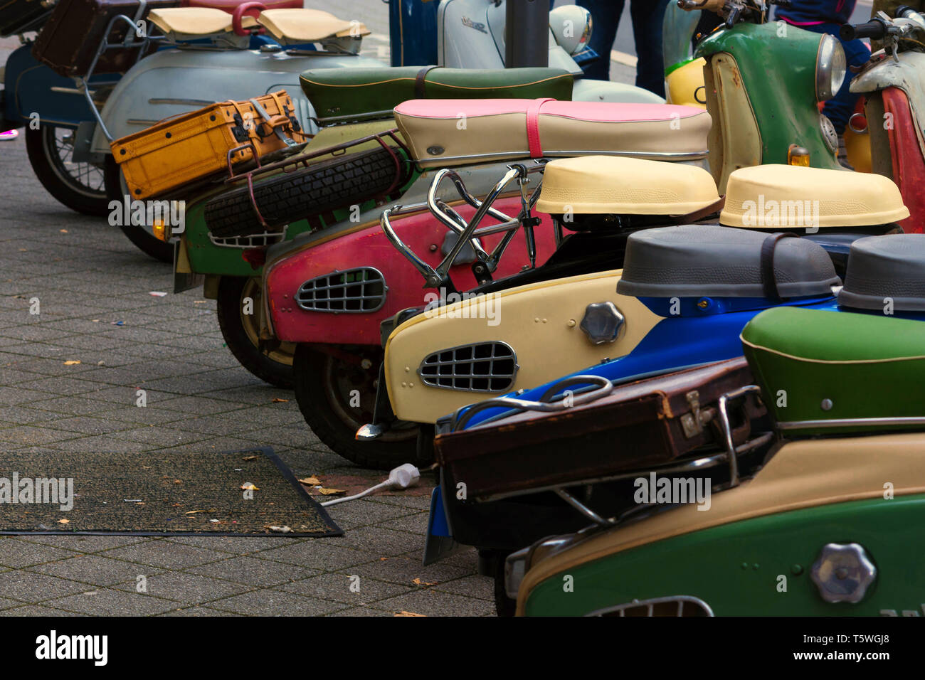 Various retro scooters line the road in a row Stock Photo - Alamy