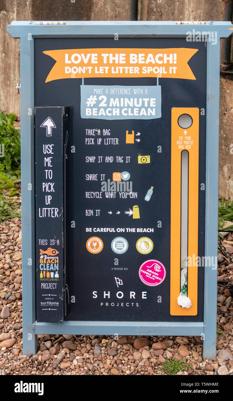 Sign and litter bin on Sidmouth beach - beach cleaning exercise, keep ...