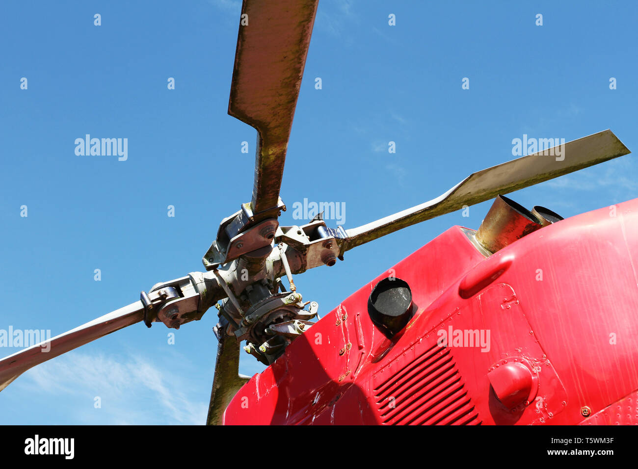 Red helicopter of air ambulance isolated on blue sky background. Detail ...