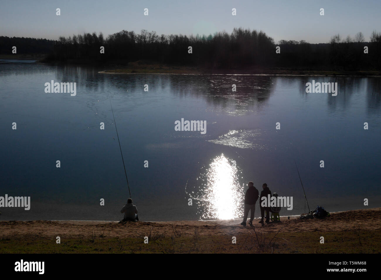 Fishing in the sunrise Stock Photo - Alamy