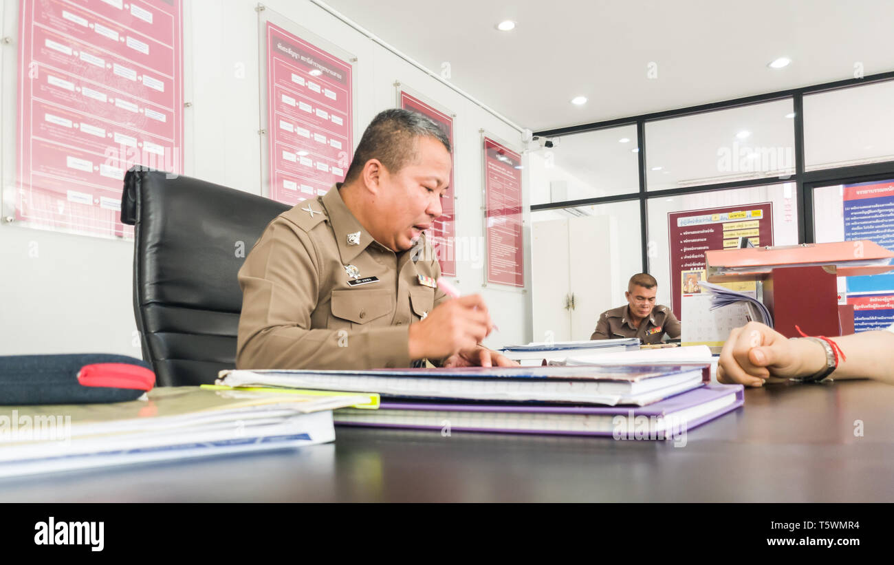 Thai Police Officer (Police Sergeant Major) on duty at a local Thai ...