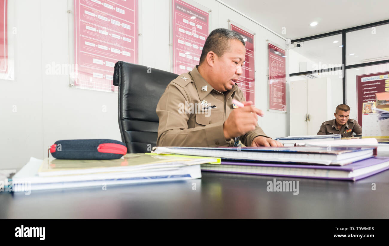Thai Police Officer (Police Sergeant Major) on duty at a local Thai ...