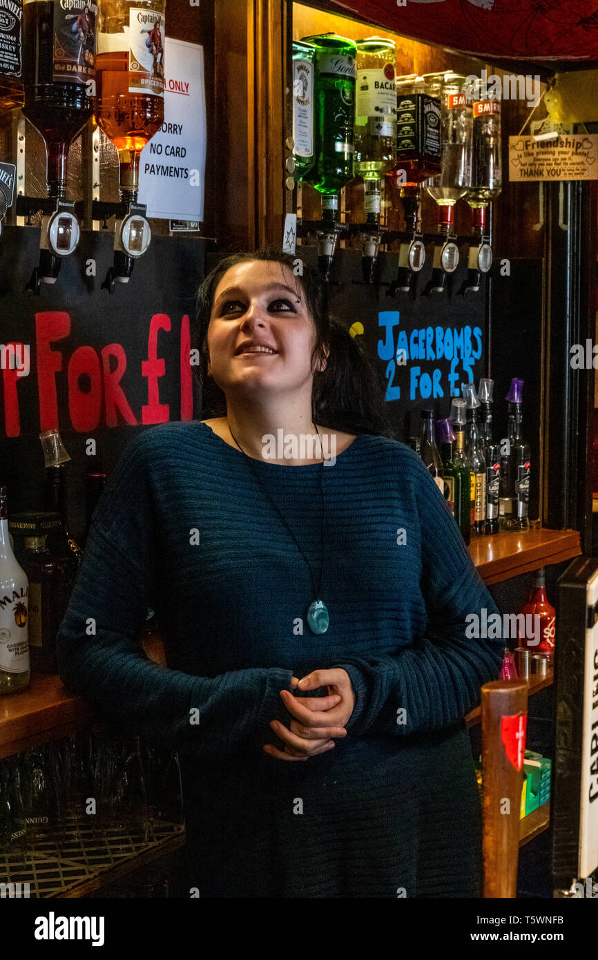 A barmaid at The Five Alls pub poses for photographers. Chepstow street ...
